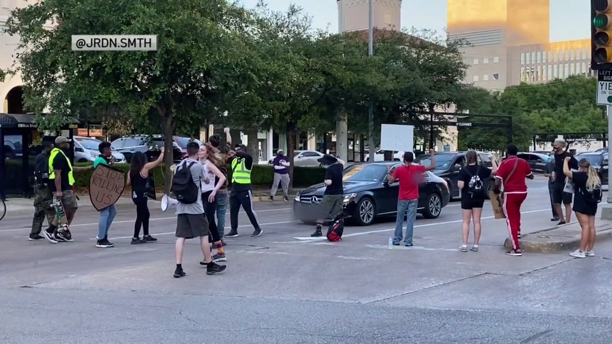 Videos Show Tense Confrontation as Driver Pushes Car into Protester in ...